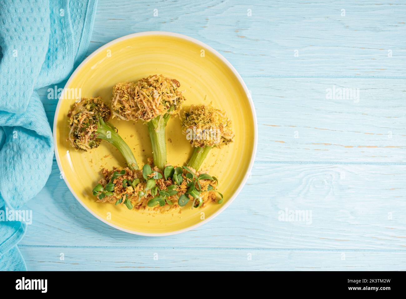 Kids food. Baked broccoli look like trees, ready to eat Stock Photo - Alamy