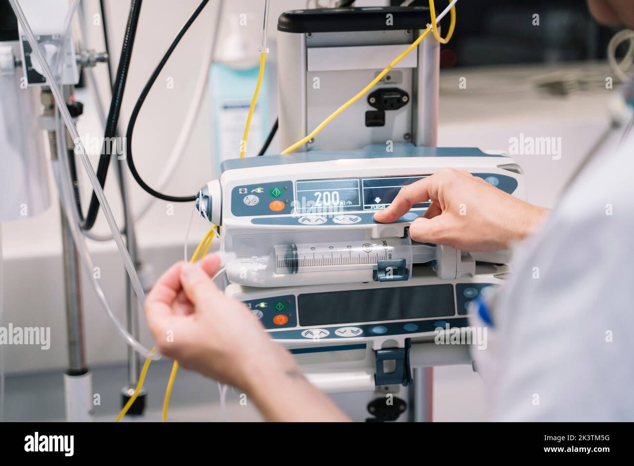 Back view of unrecognizable doctor male adjusting and controlling ...