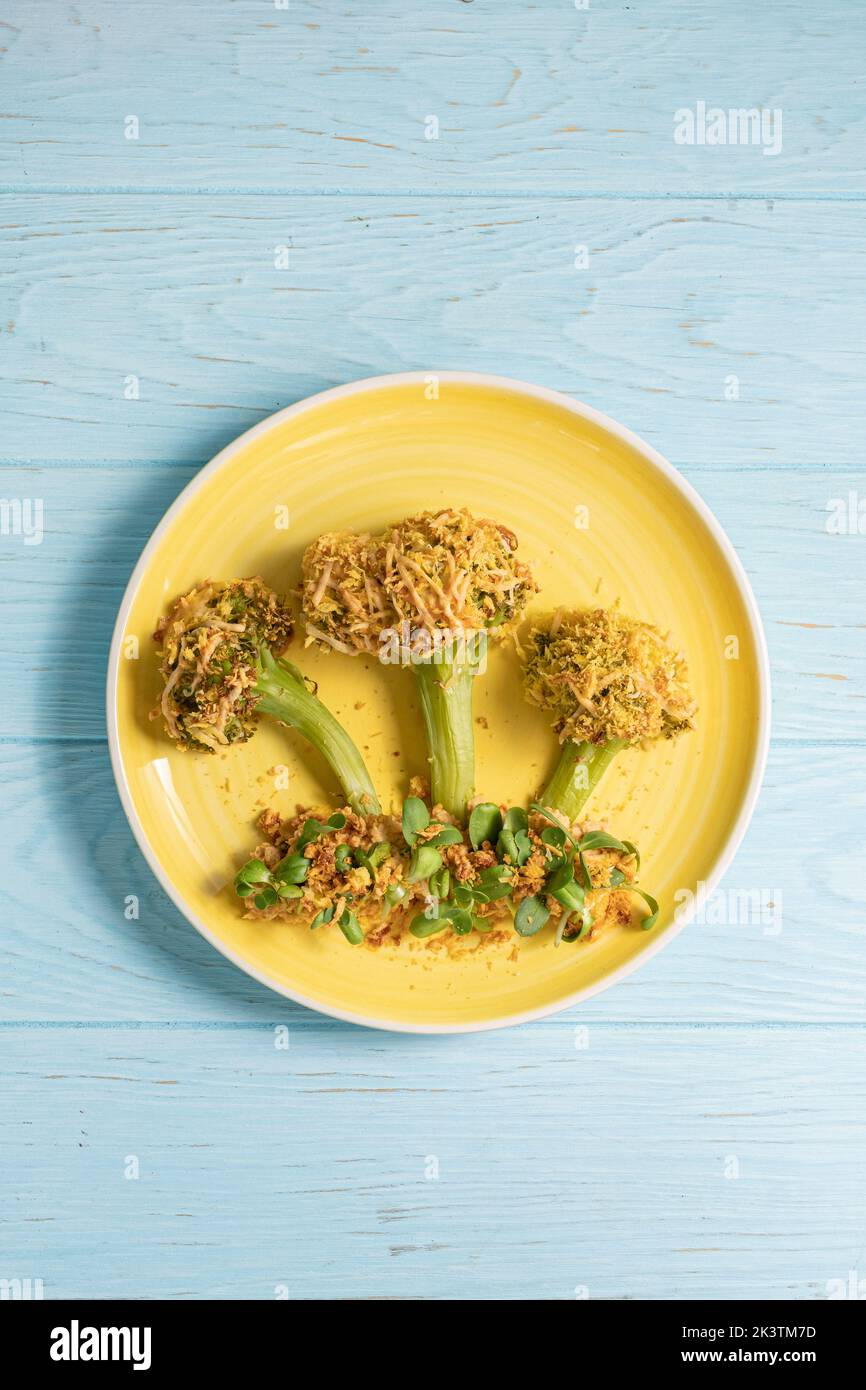 Kids food. Baked broccoli look like trees, ready to eat Stock Photo - Alamy