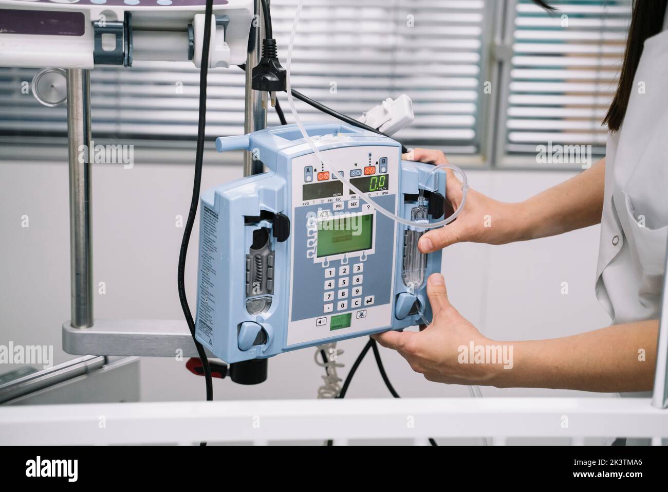 Side view of unrecognizable doctor male adjusting and controlling ...