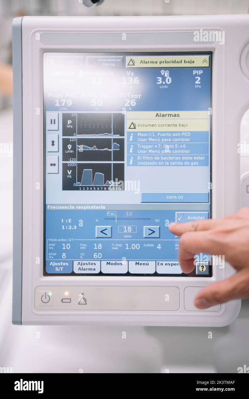 Side view of unrecognizable doctor male adjusting and controlling ...