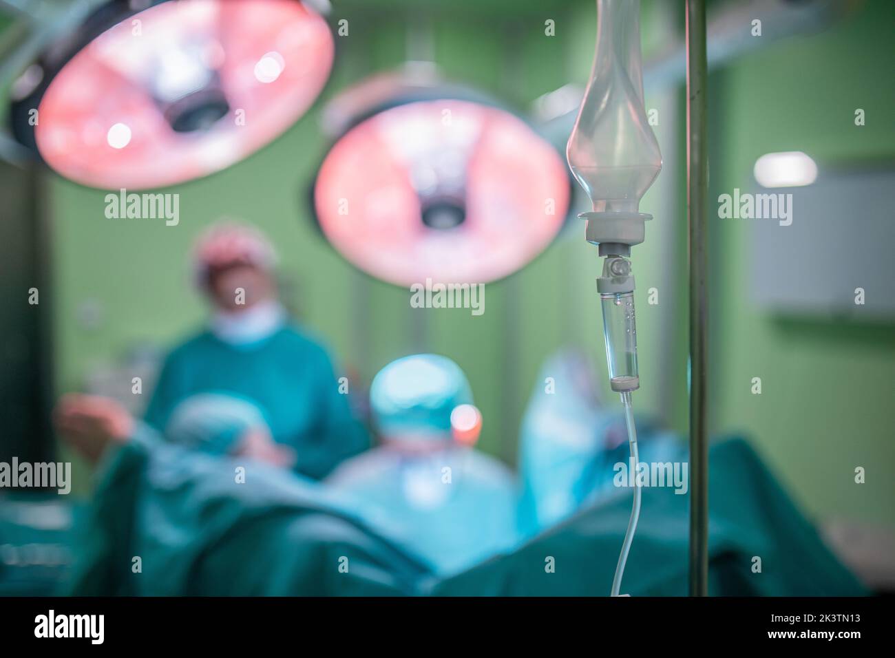 Drip bag with anesthesia drug hanging on stand during surgery on ...