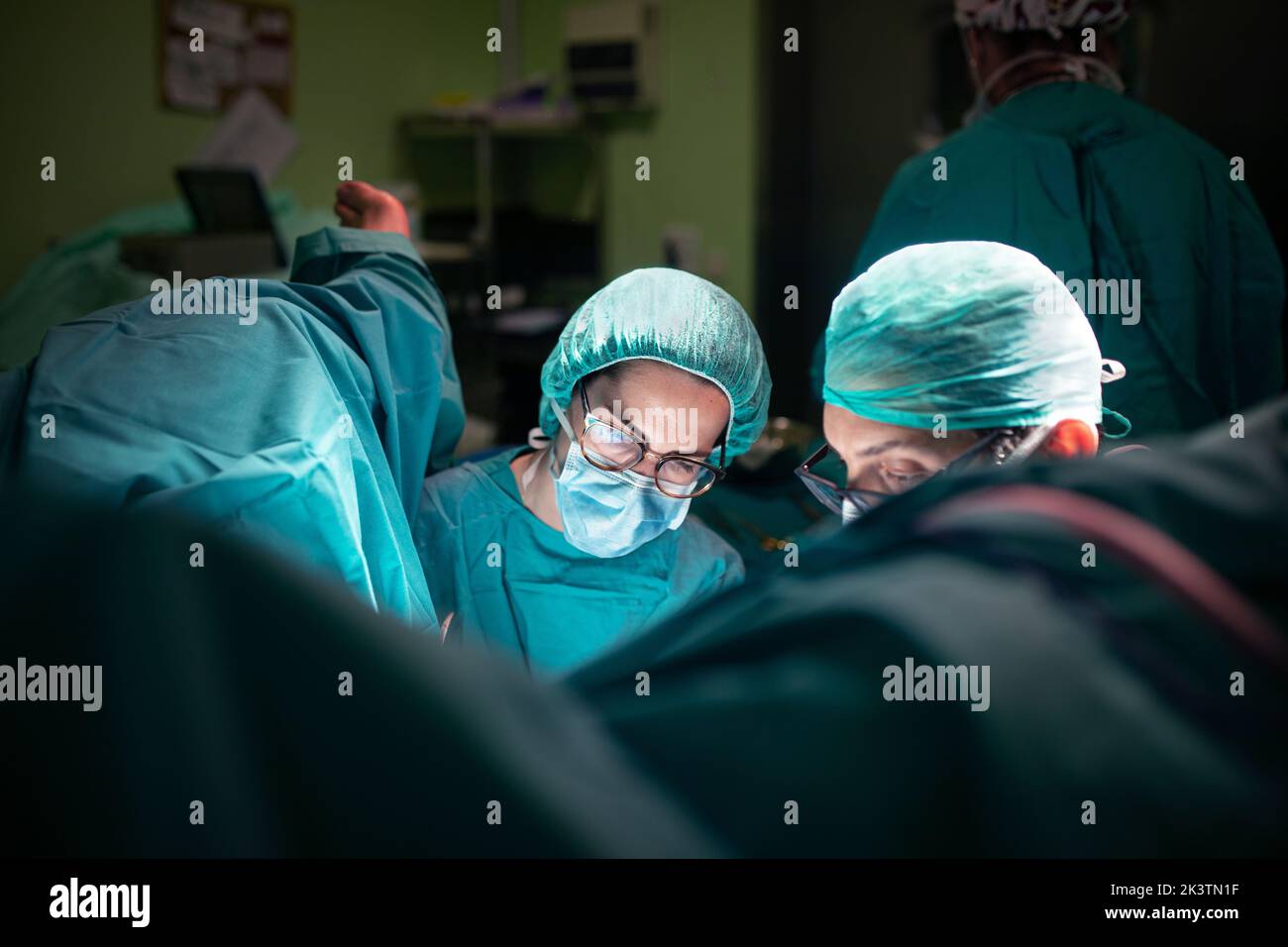Male doctor and female assistant preparing clean tools before surgery ...