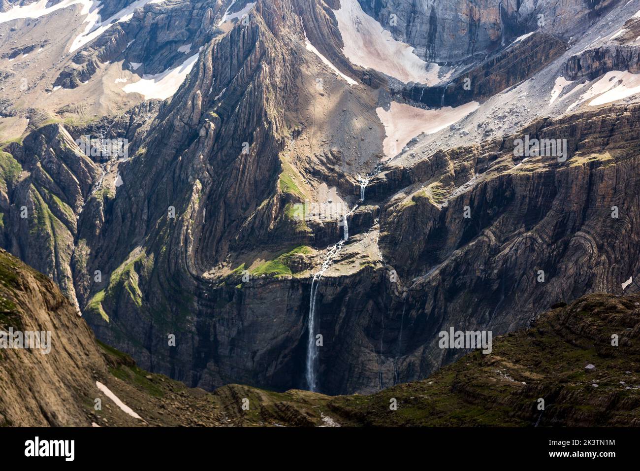 Thin stream of clean water flowing on rough mountain slope in Cirque de ...