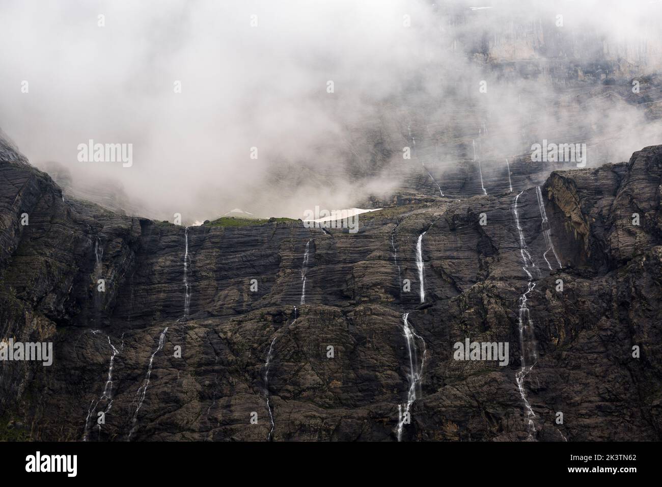 Thin stream of clean water flowing on rough mountain slope in Cirque de ...