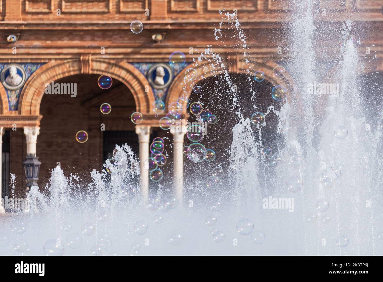Fountain with splashing water and soap bubbles on Plaza de Espana on ...
