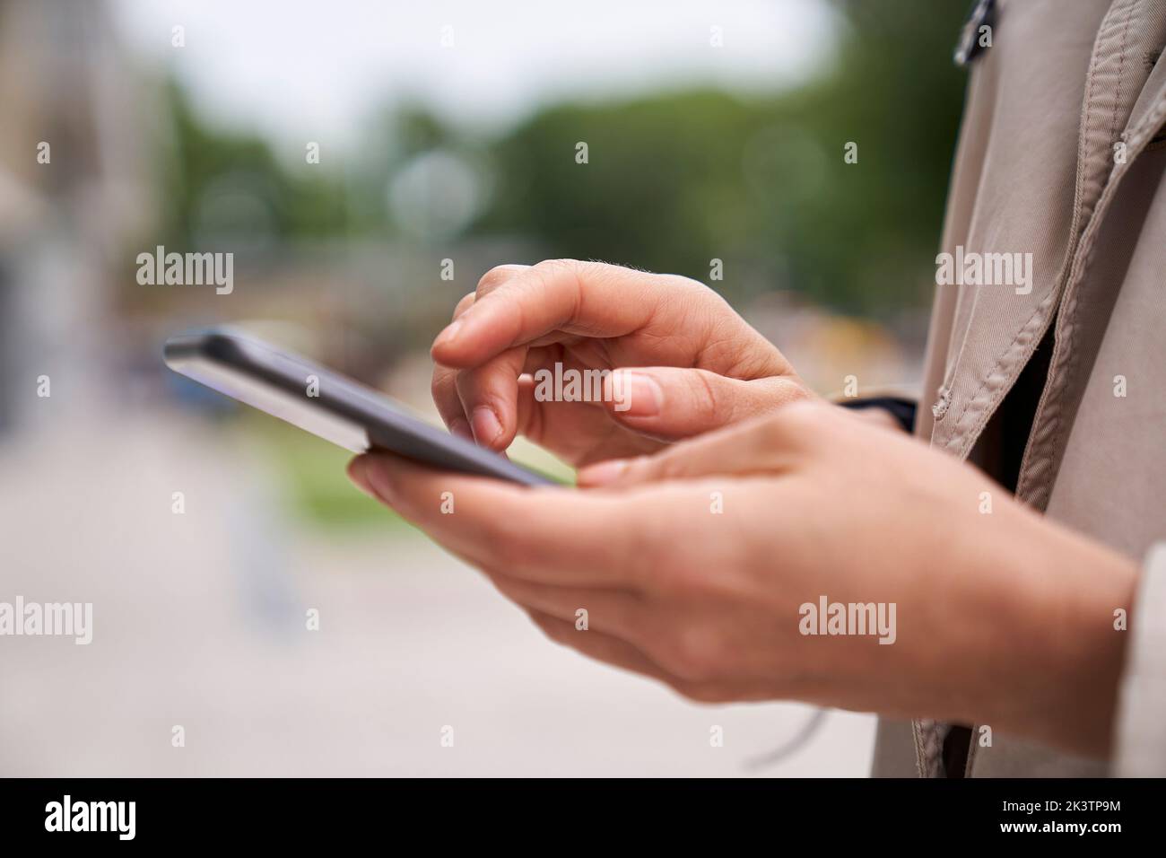 close-up shot of woman's hands tapping on a mobile phone screen Stock ...