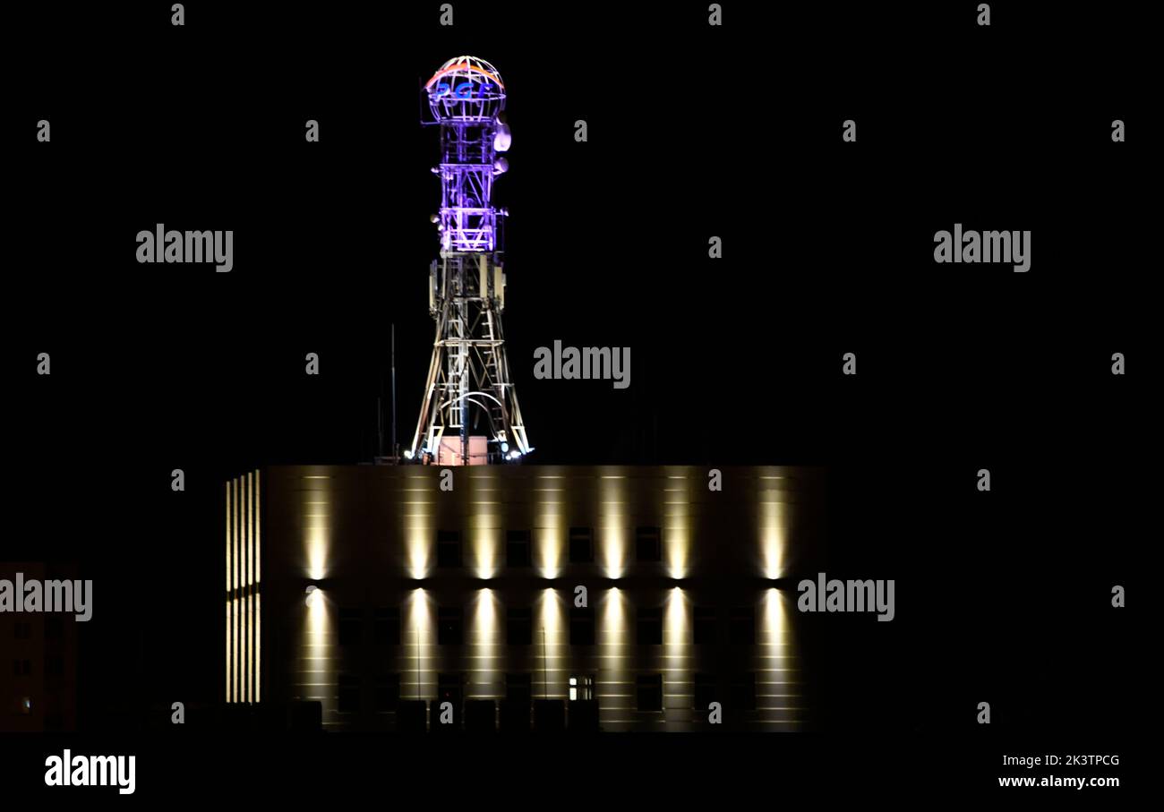 Communications tower, lit up at night Stock Photo - Alamy