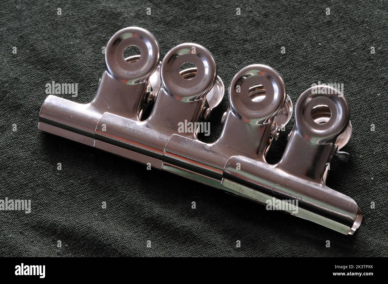 Steel hinged bulldog paper clips Stock Photo - Alamy