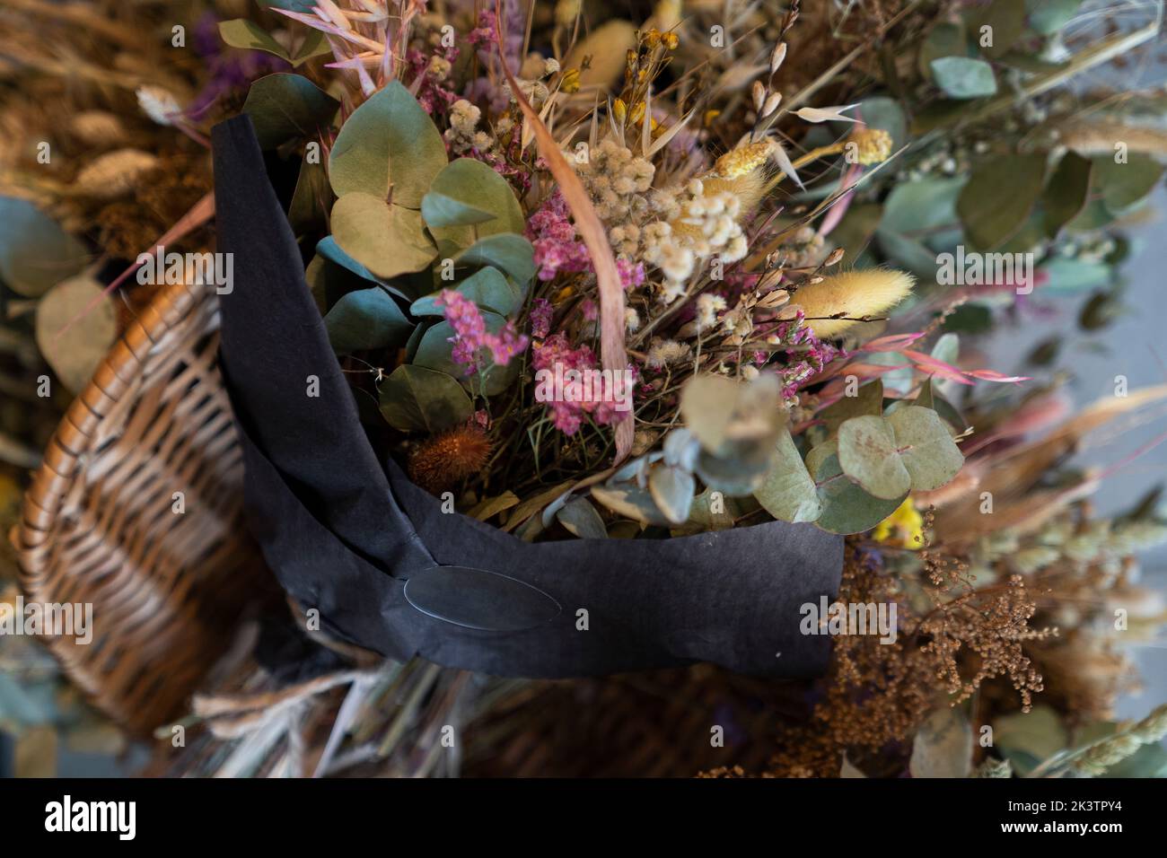 Bunch of decorative dried flowers inside a basket Stock Photo - Alamy