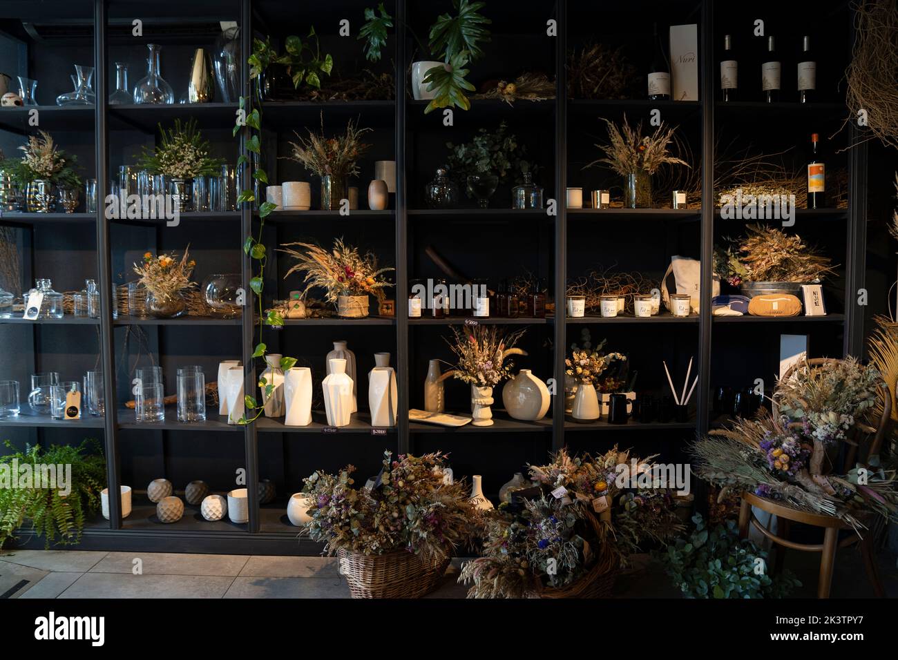 Partial view of shelves inside an interior design shop with various ...