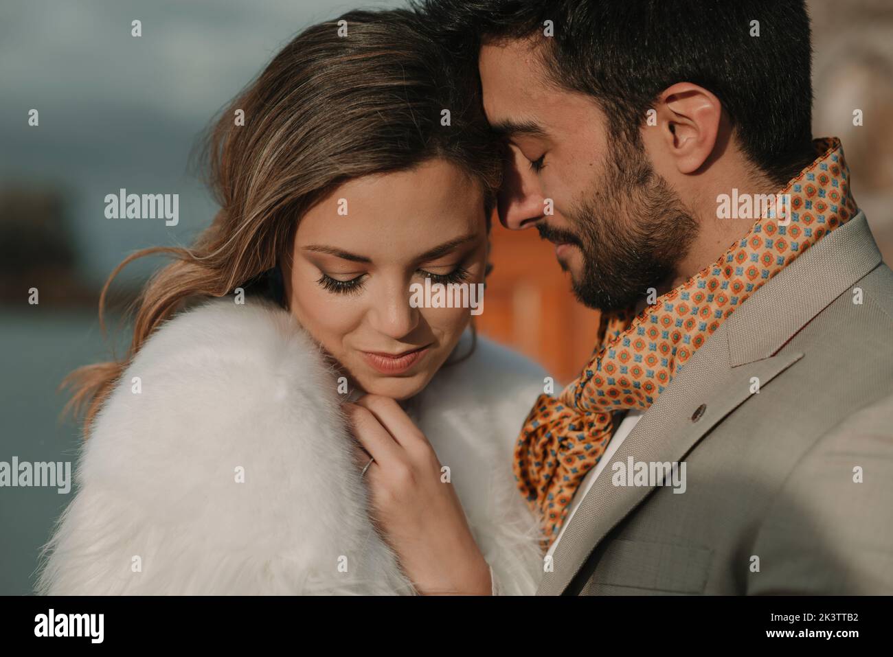 Side view of handsome bearded positive man near charming beautiful ...