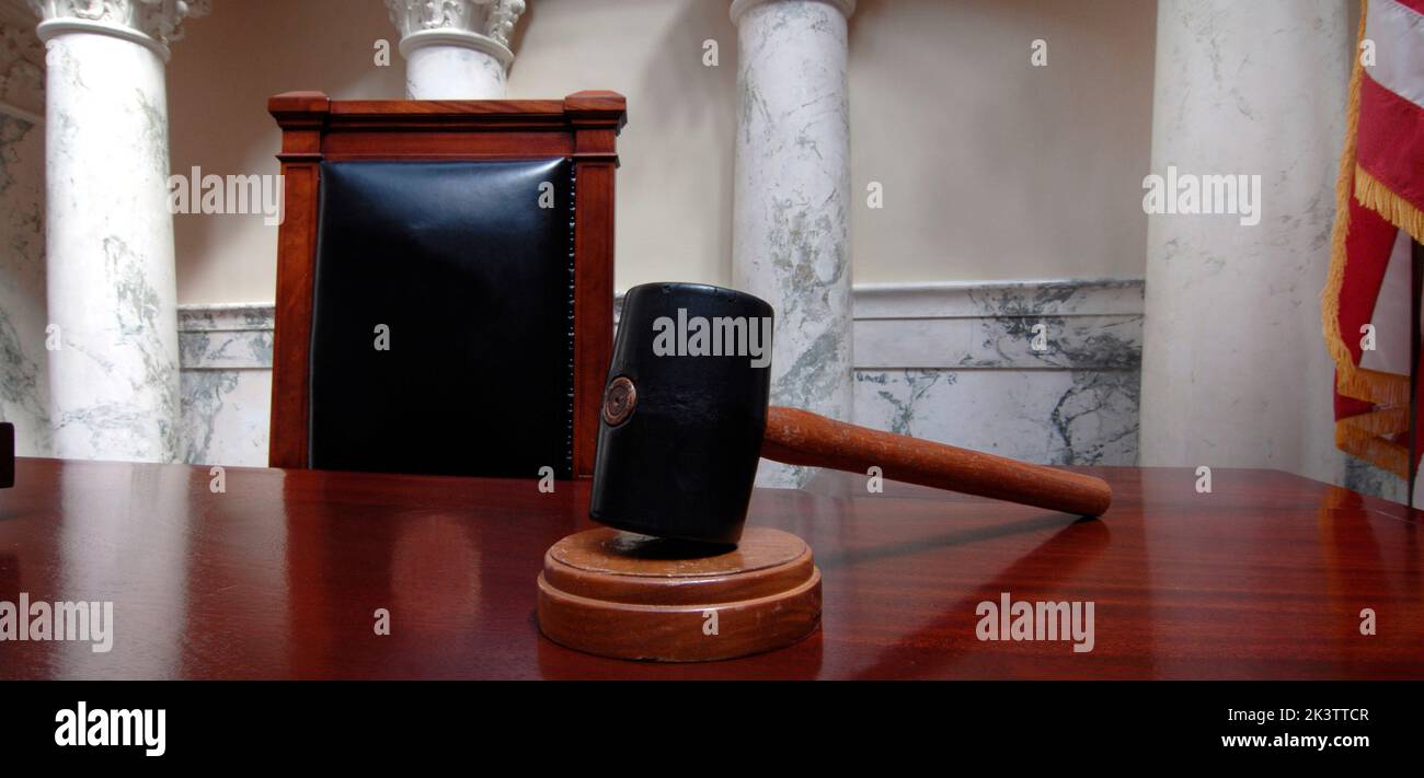 Gavel on wooden desk or table in Court or legislature lawmaker office ...