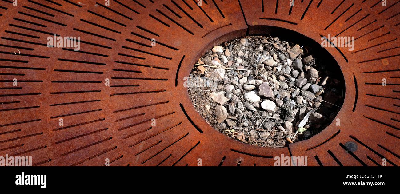 Rusty metal grate texture with rocks and soil in circle shape Stock ...