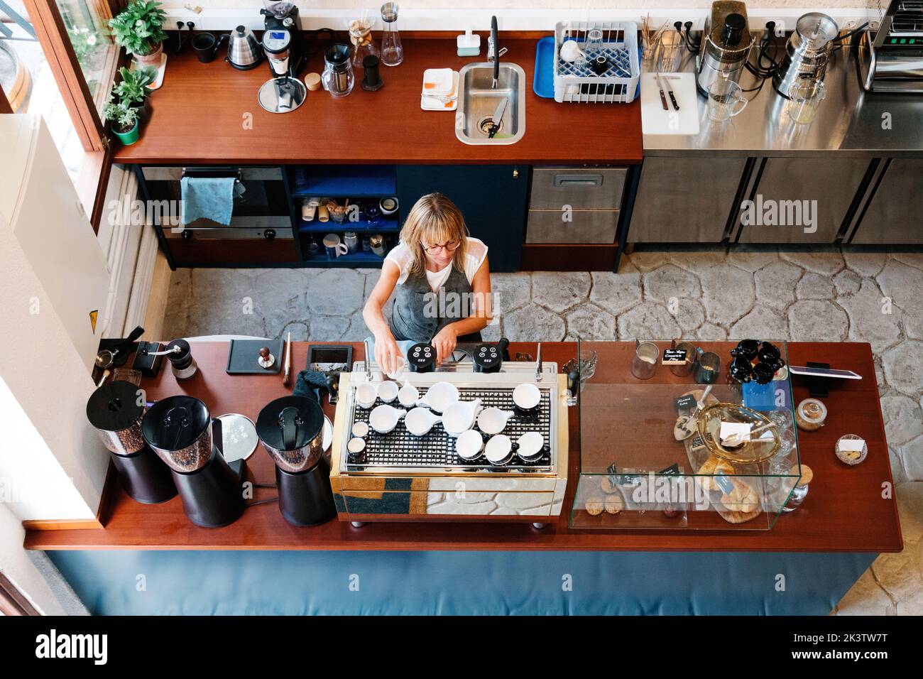 Woman behind bakery counter hi-res stock photography and images - Alamy
