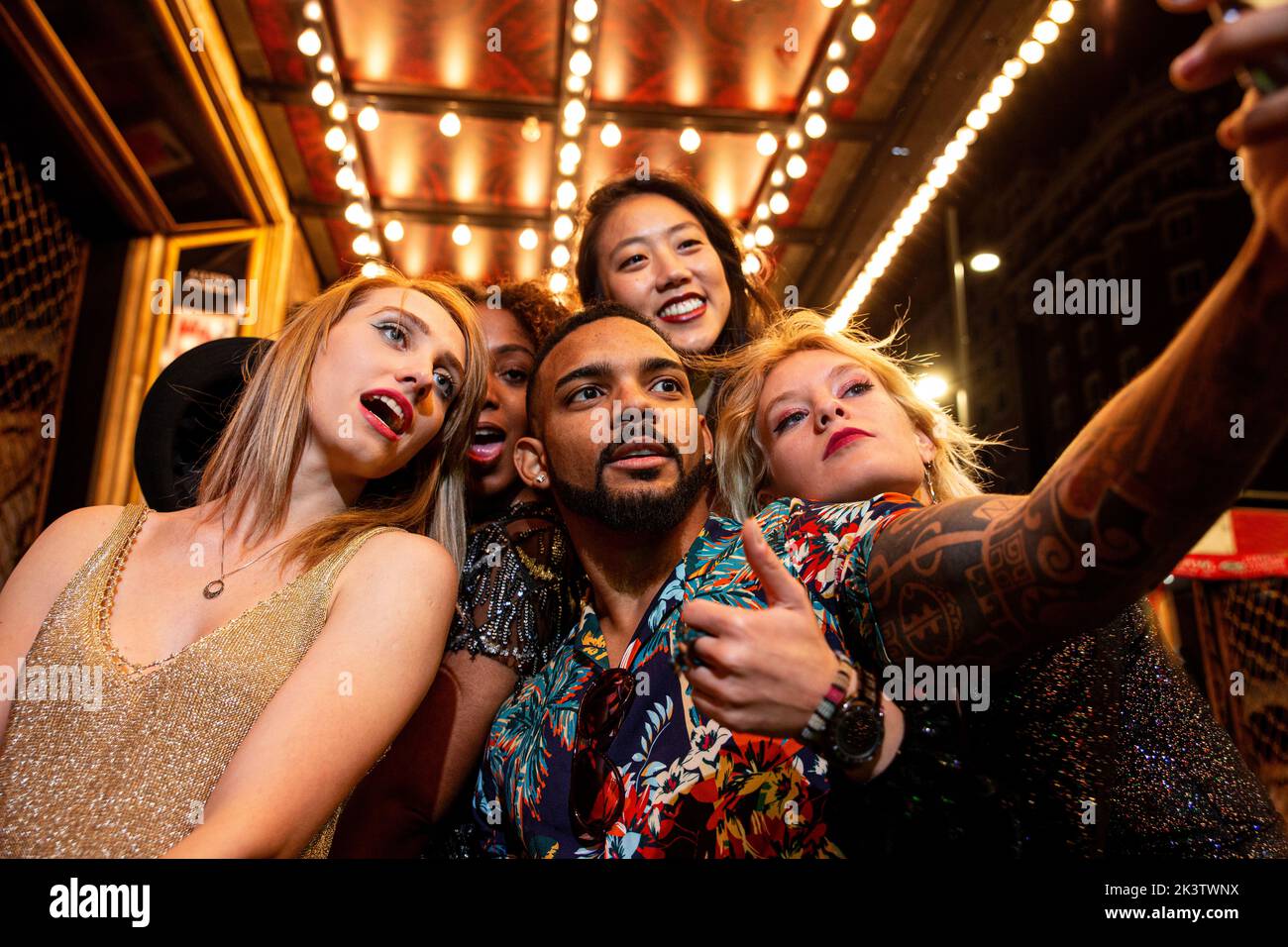 Young content diverse partners making faces while taking self portrait ...