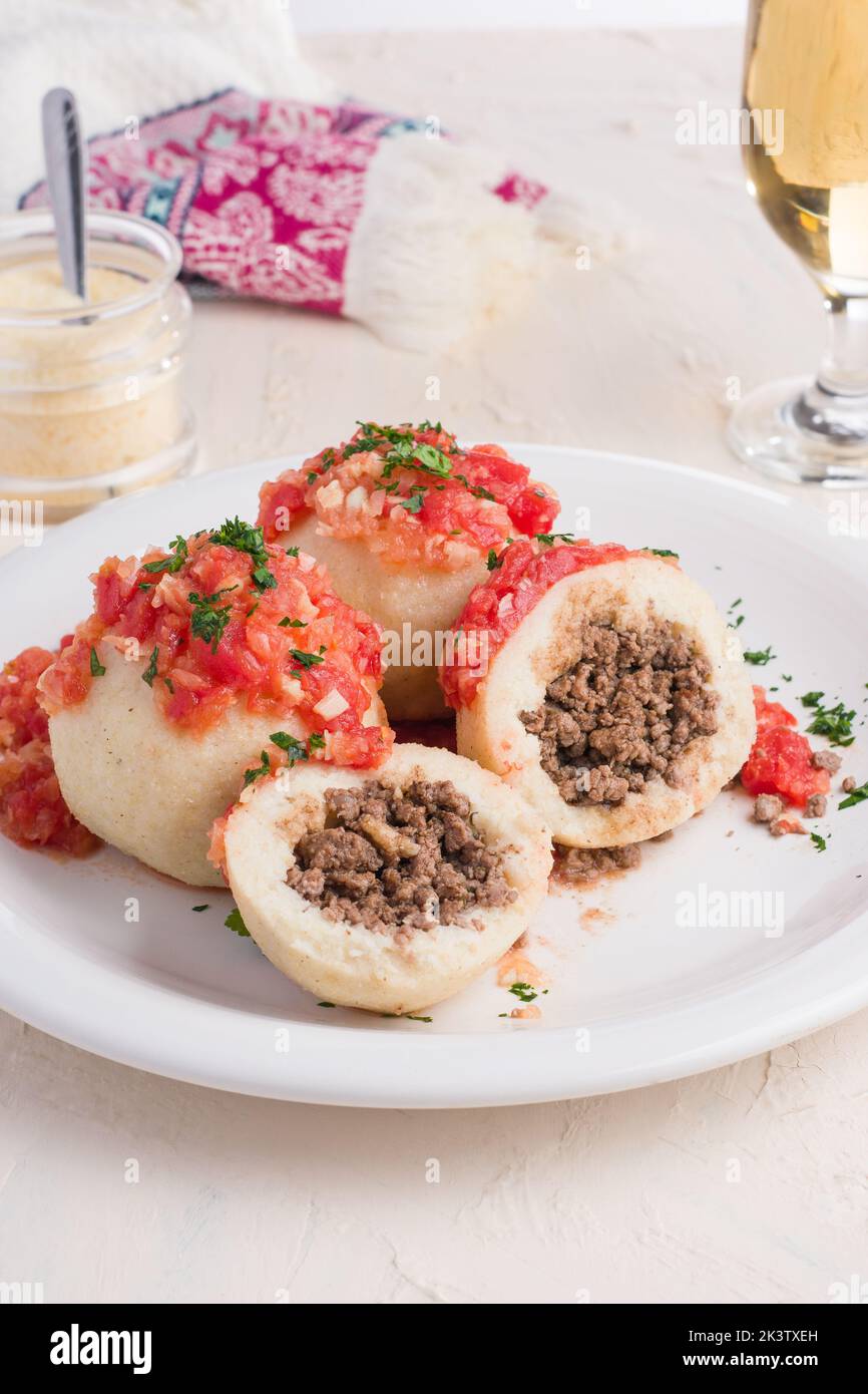 High angle of plate with bollos pelones delicious ground beef meatballs covered in arepa dough ...