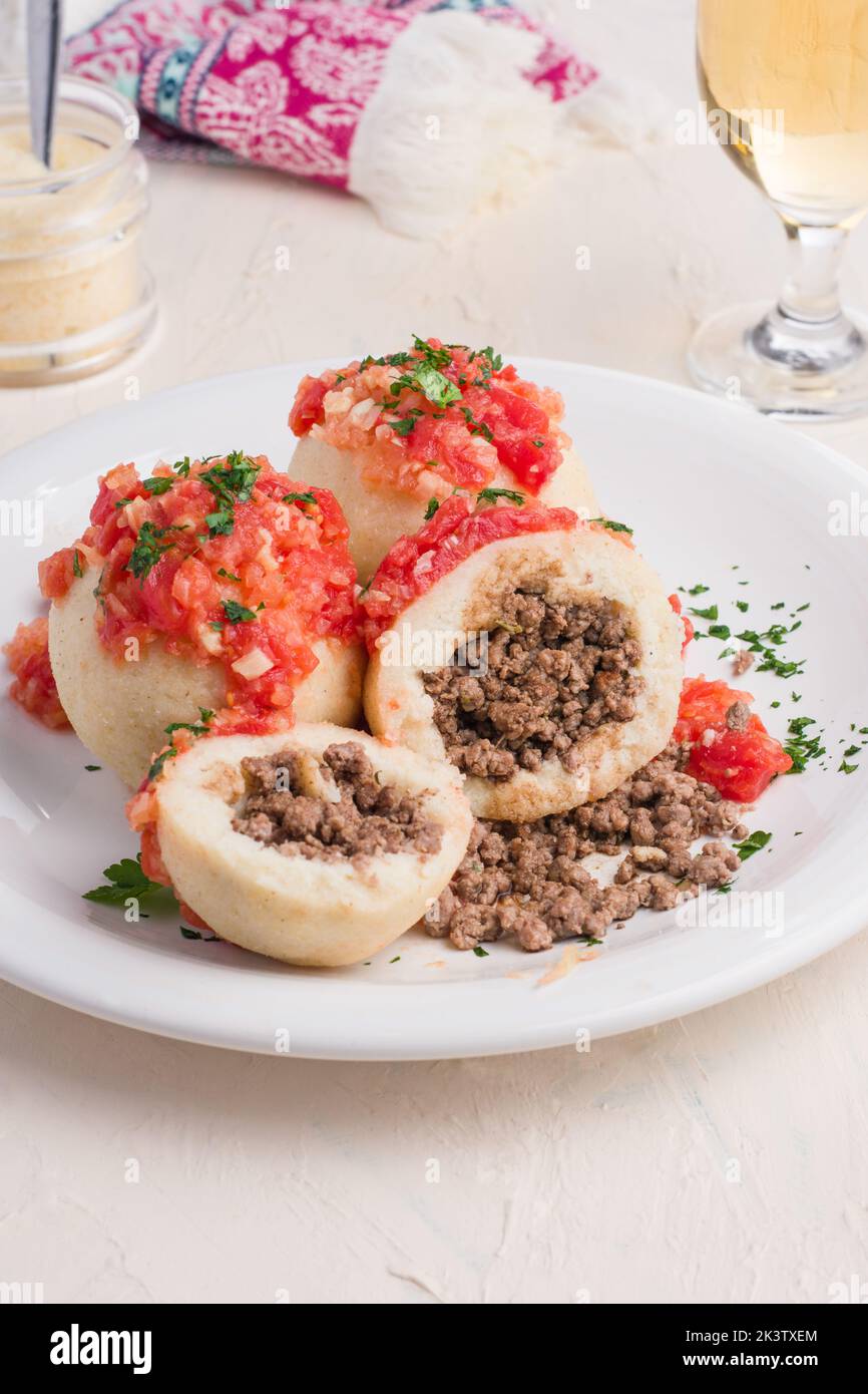 High angle of plate with bollos pelones delicious ground beef meatballs covered in arepa dough ...