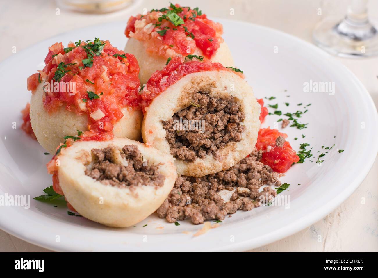High angle of plate with bollos pelones delicious ground beef meatballs covered in arepa dough ...