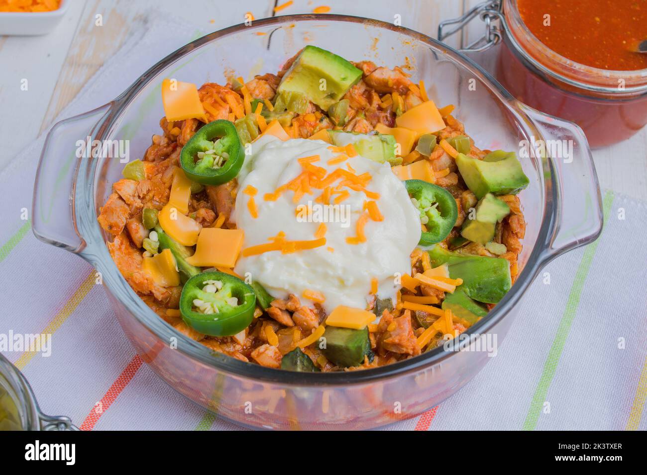 High angle of glass bowl with delicious Chicken Salad Enchilada with ...