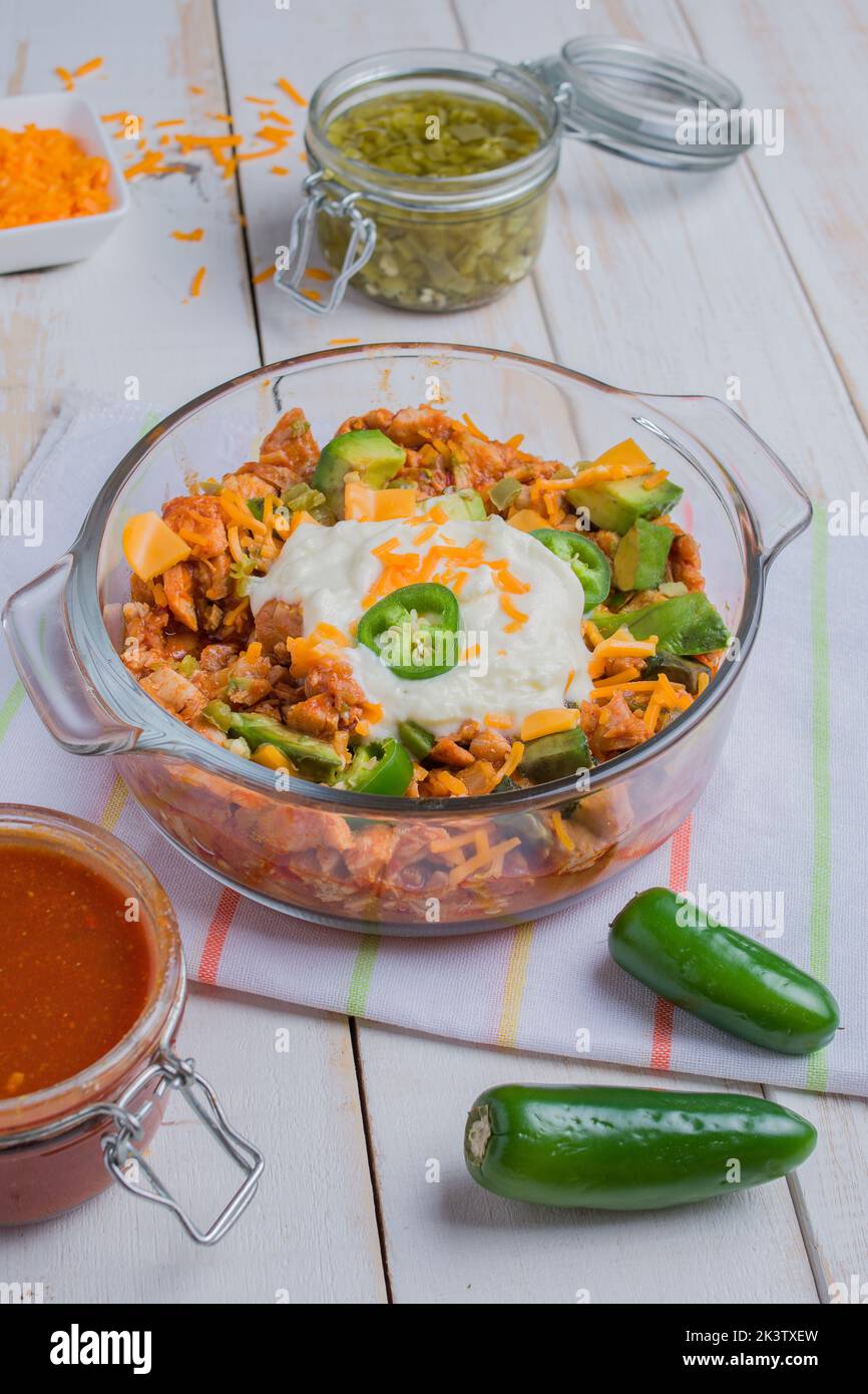 High angle of glass bowl with delicious Chicken Salad Enchilada with ...