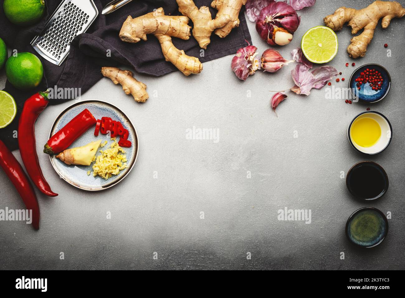 Asian cuisine ingredients, food background. Ginger, lime, chili pepper ...