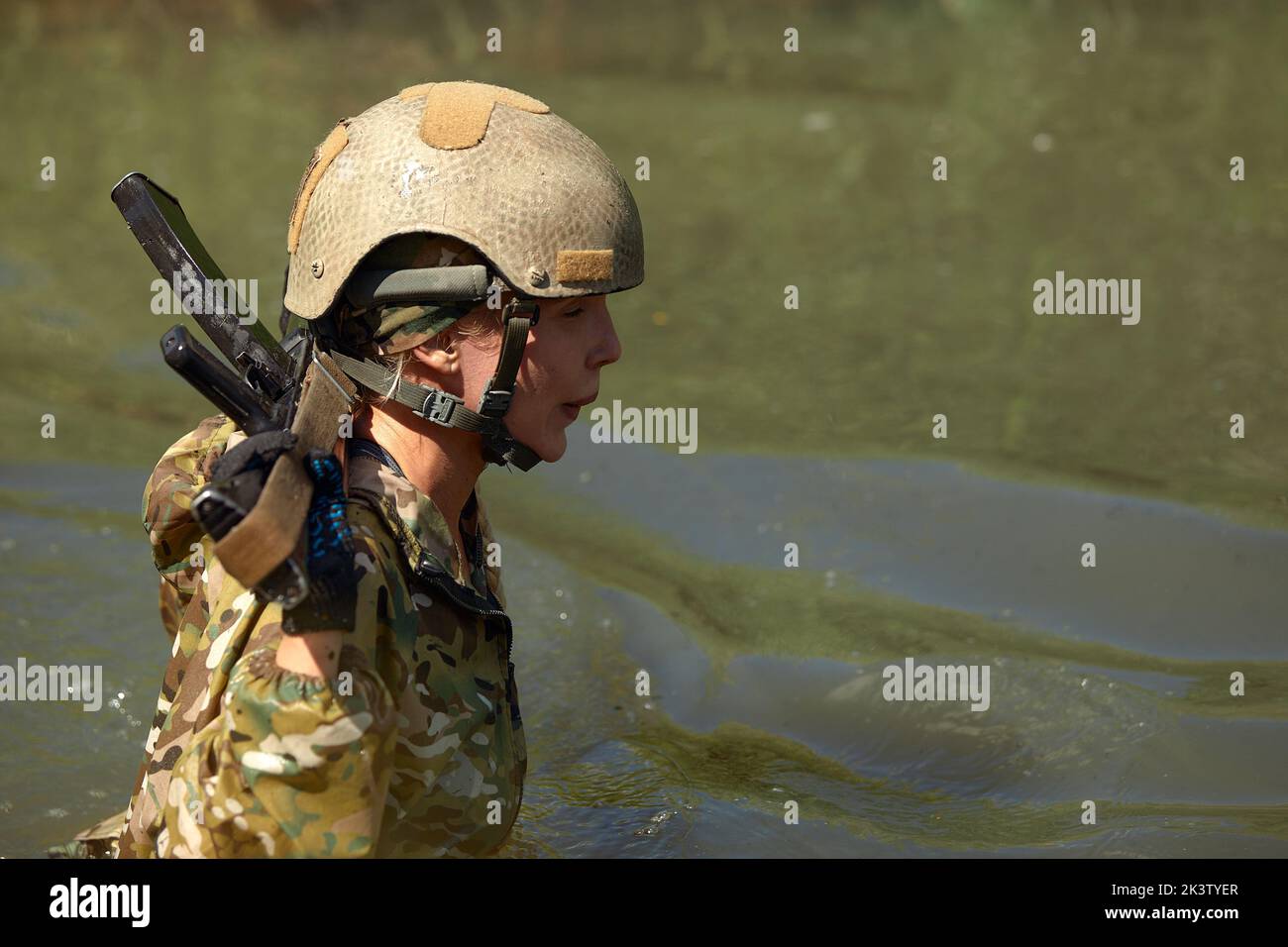 Special forces soldier with weapon take part in military maneuver. War ...