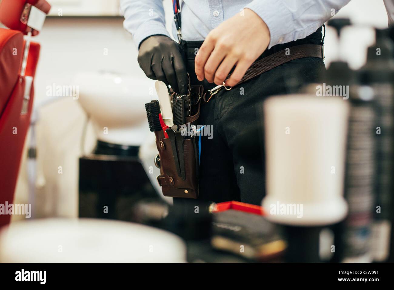 Barber tools in a leg pouch: scissors, razors, combs Stock Photo - Alamy
