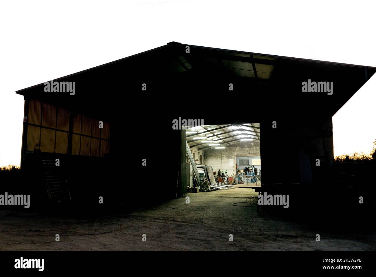 Interior of spacious industrial workshop with various metal elements ...