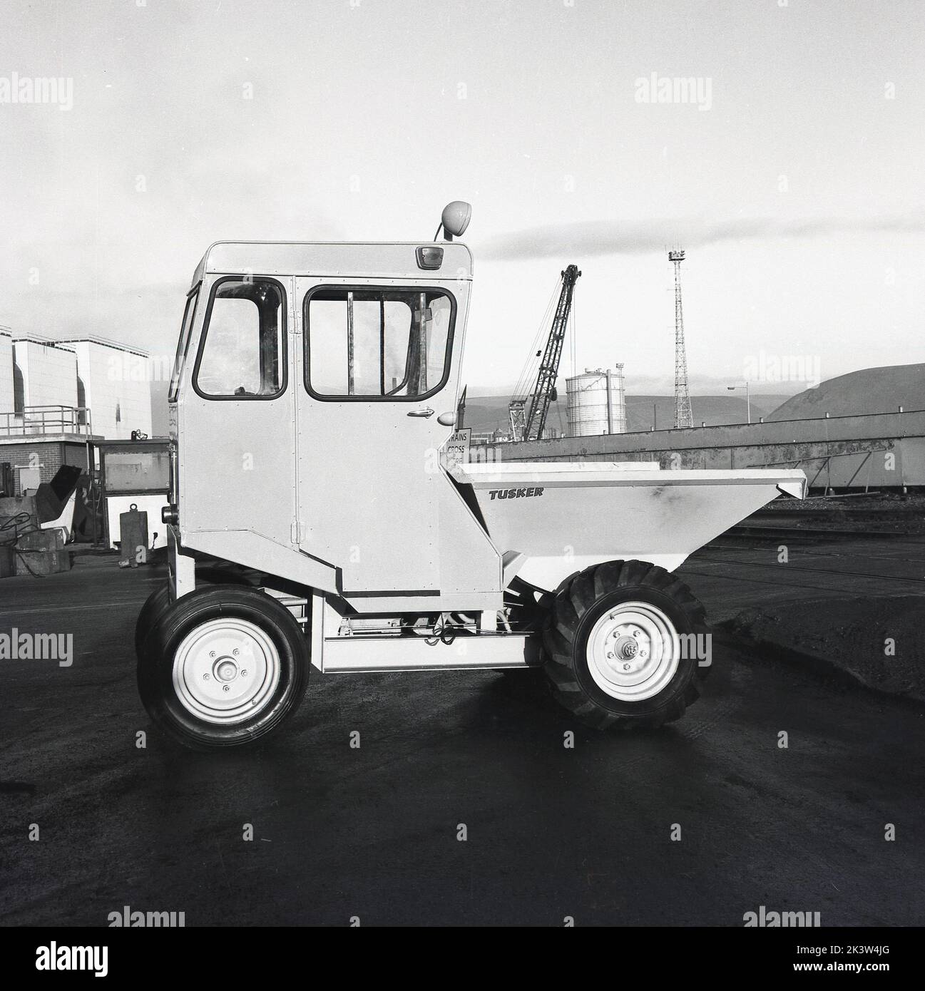 1950s, historical, side view of a mini back or reverse dumper truck ...