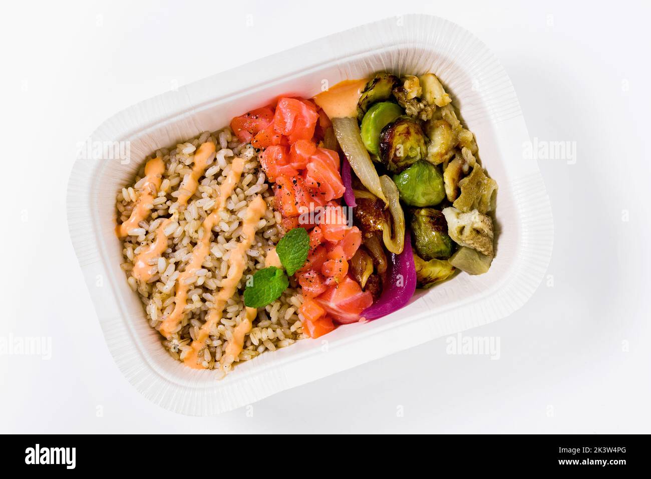Poke with brown rice, salmon and grilled vegetables in a plastic ...