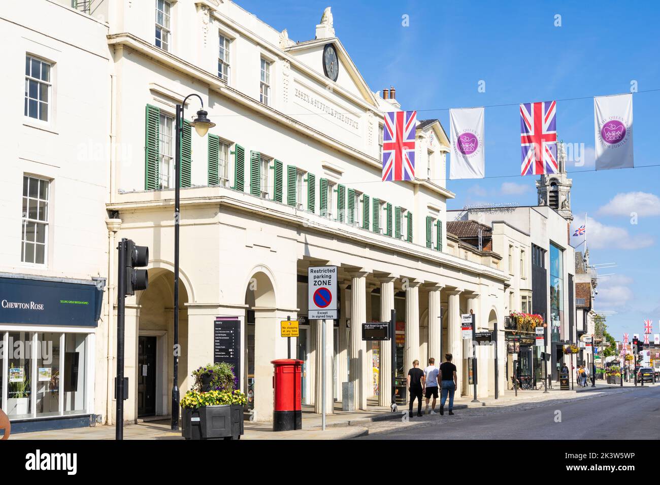 People walking down Colchester High Street past the old Essex and ...