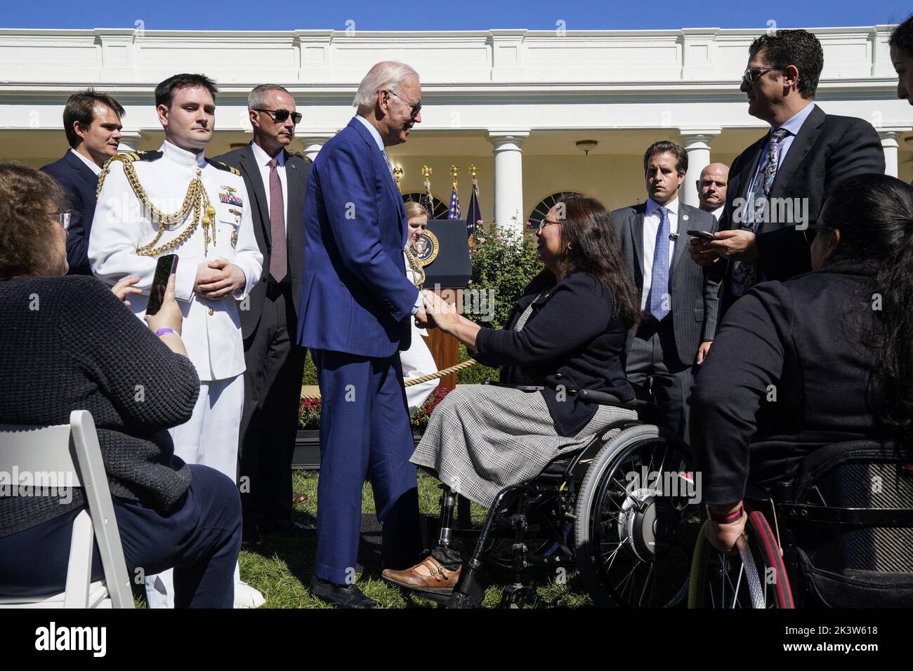 President Joe Biden greets Senator Tammy Duckworth during an event to ...