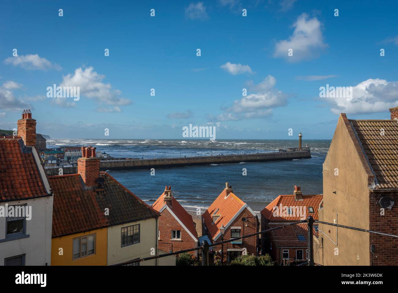View of the seaside town and port of Whitby where the River Esk flows ...