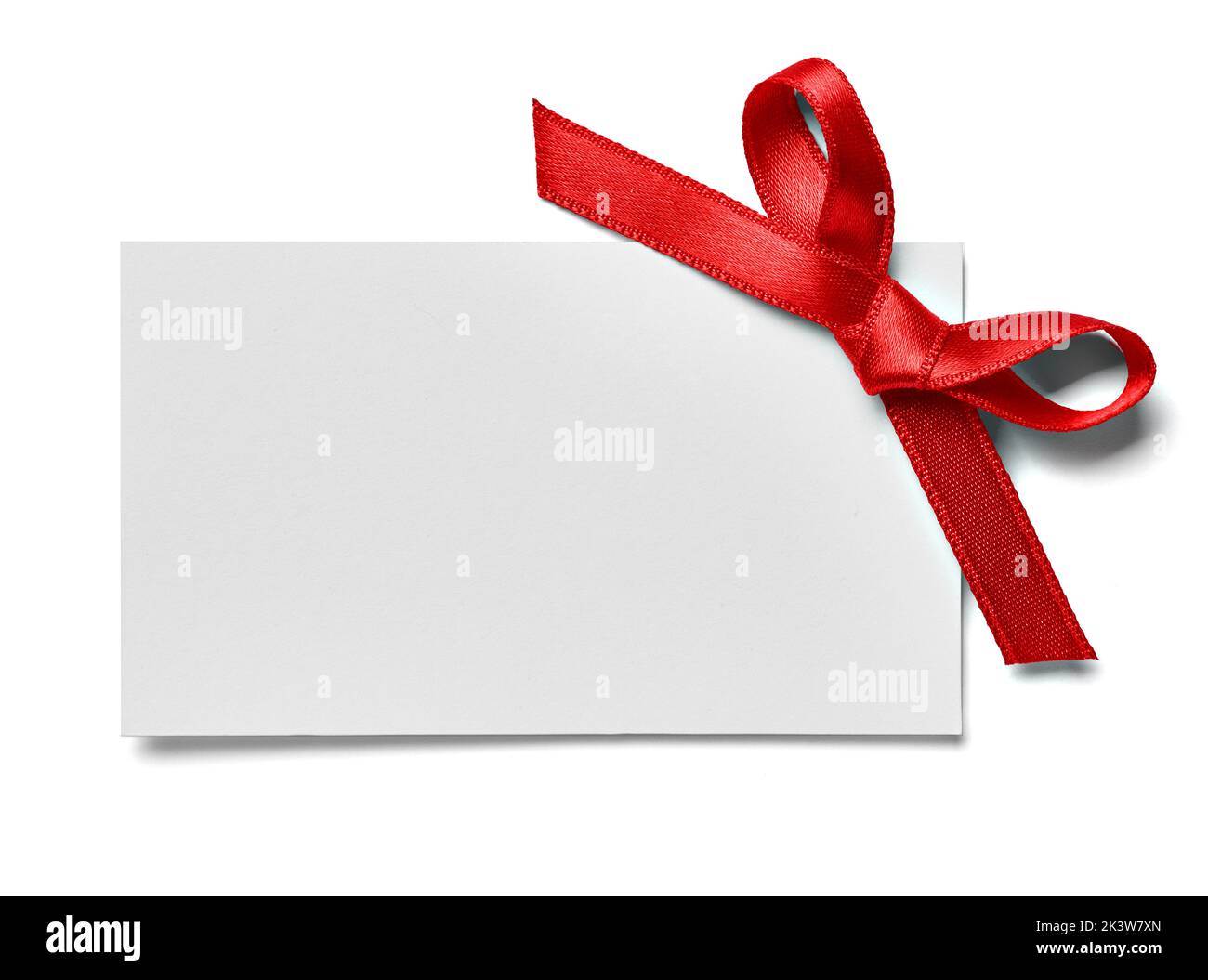 close up of a greeting card note with red ribbon on white background ...