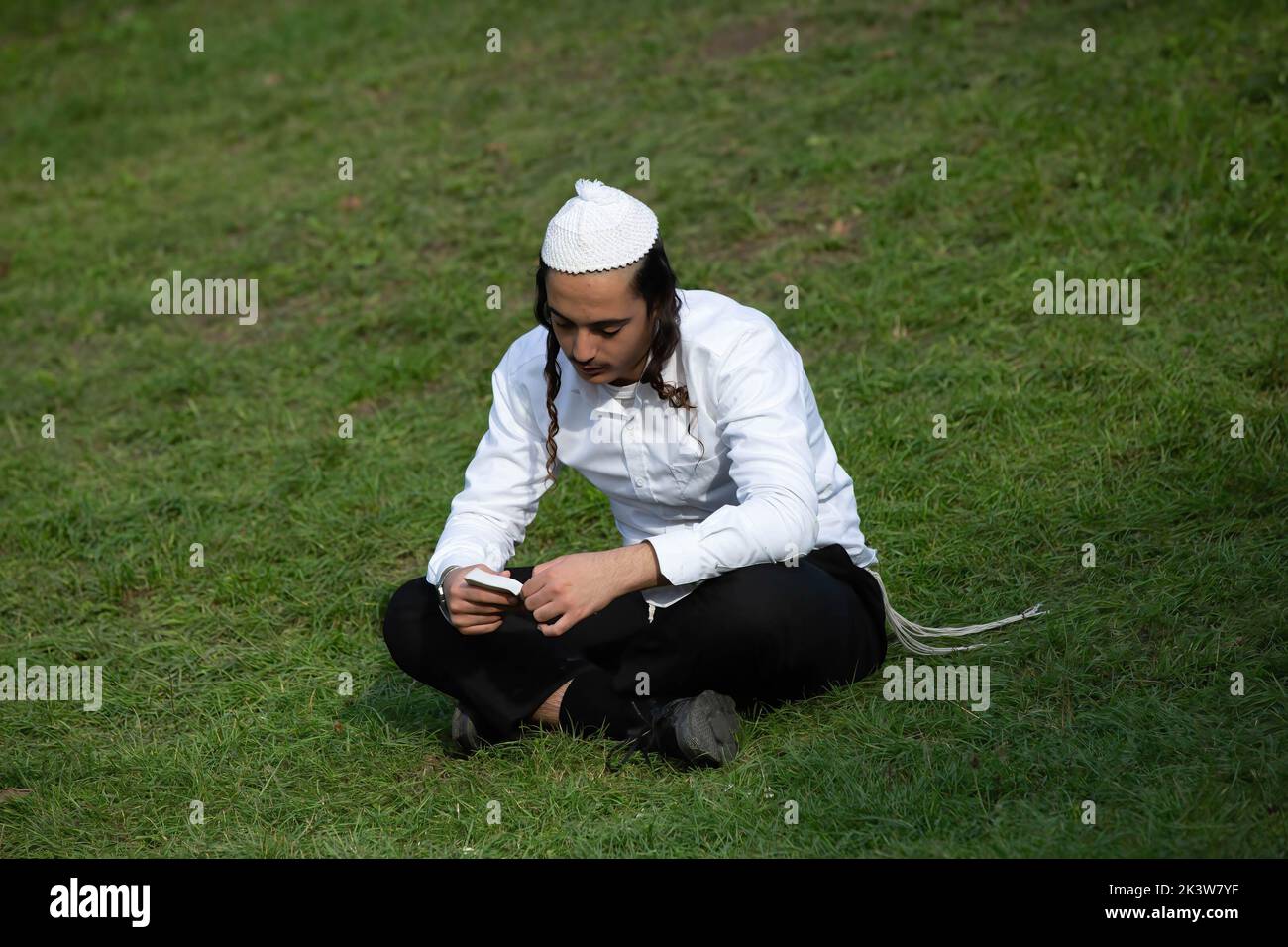 Ultra-Orthodox Jewish pilgrim prays during the celebration. Every year ...