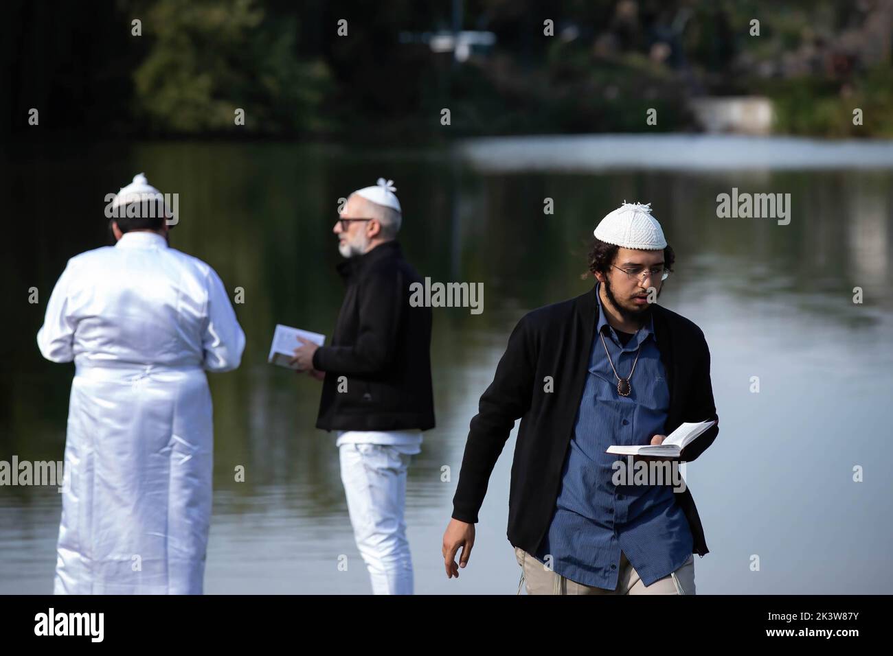Ultra-Orthodox Jewish pilgrims pray next to the river of Umanka near ...