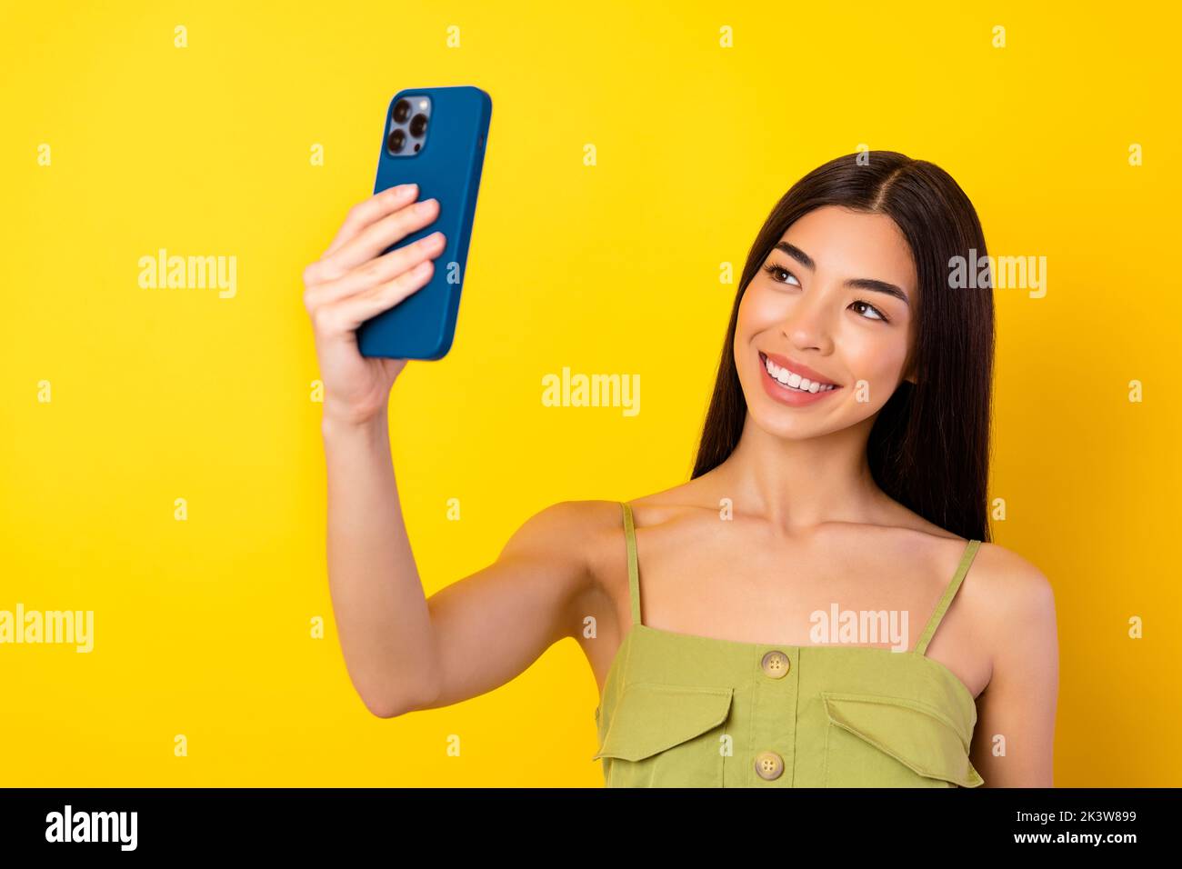 Portrait of adorable cheerful indonesian person hold telephone make ...