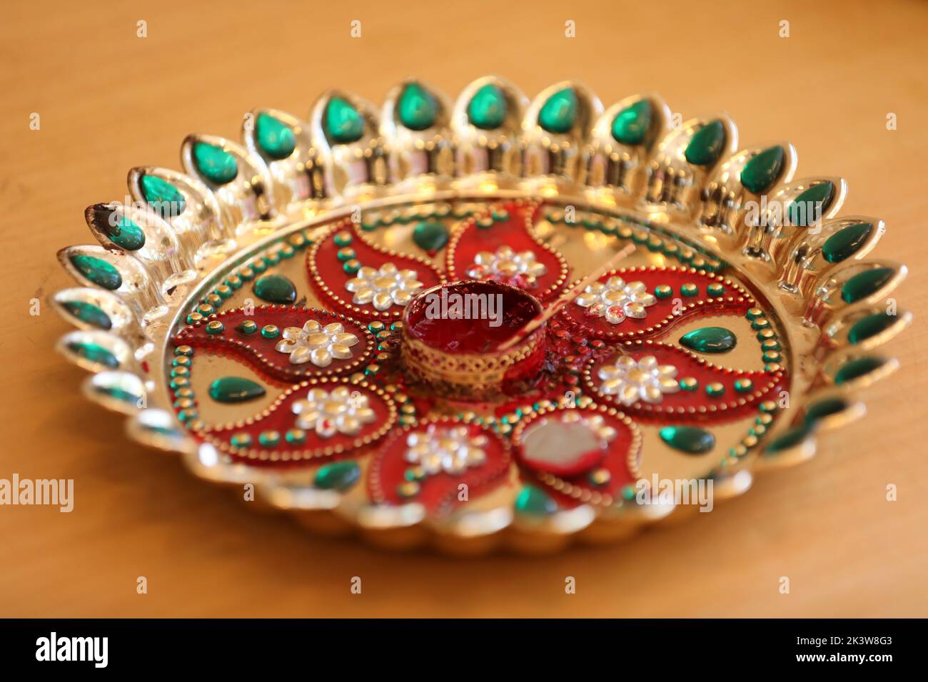 The plate used in the Tilak ceremony has different components depending ...