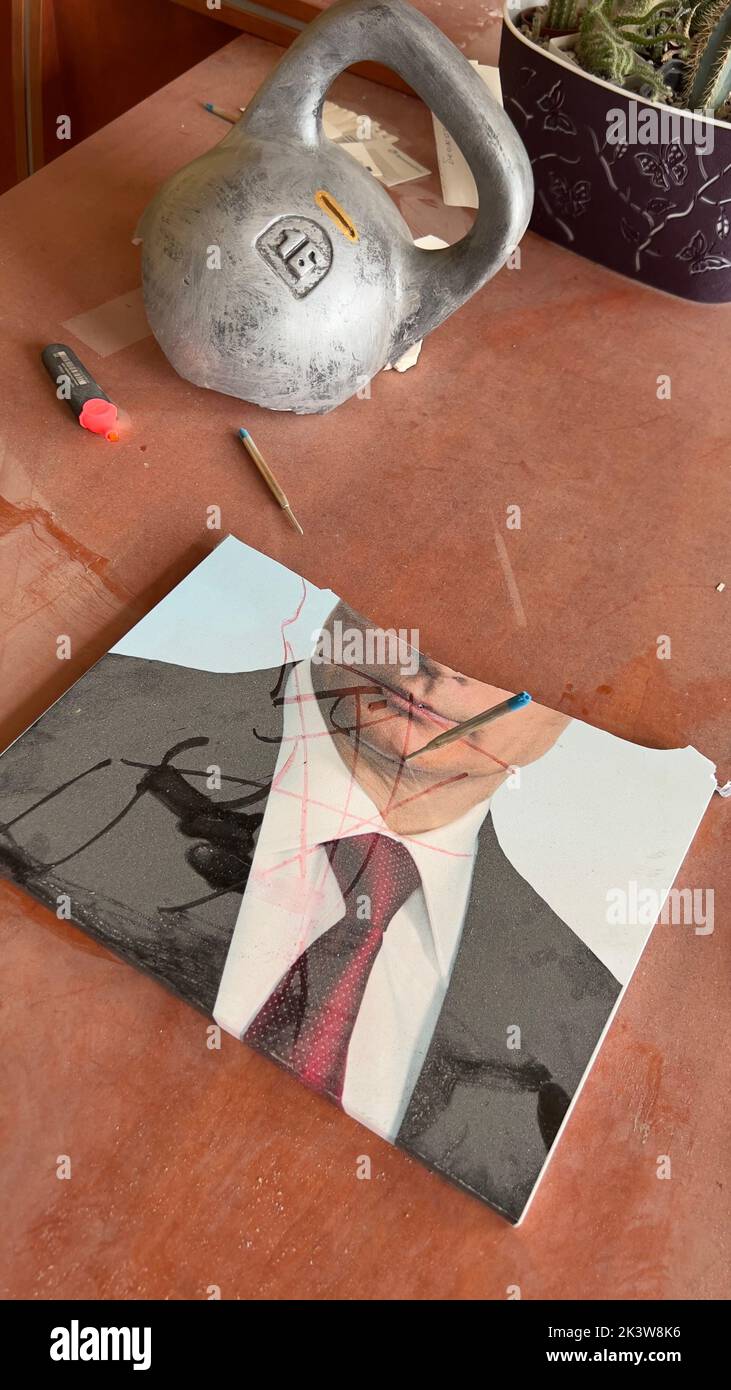 Destroyed portrait of Vladimir Putin in one of damaged buildings in ...