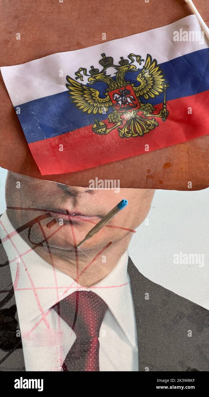 Destroyed portrait of Vladimir Putin in one of damaged buildings in ...