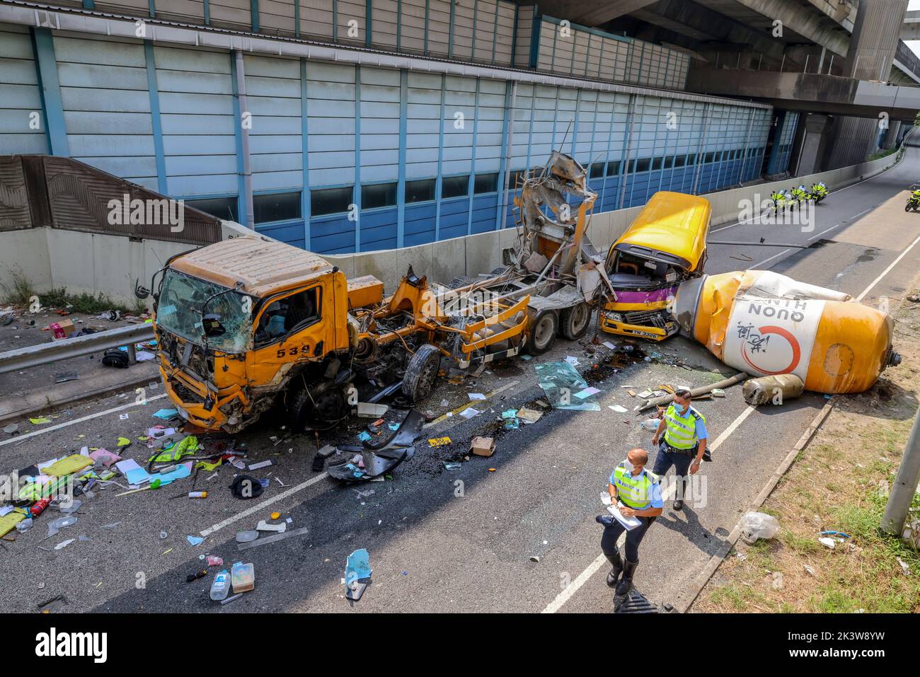 A cement mixer flew off Tsing Sha Highway flyover and hit a school bus ...