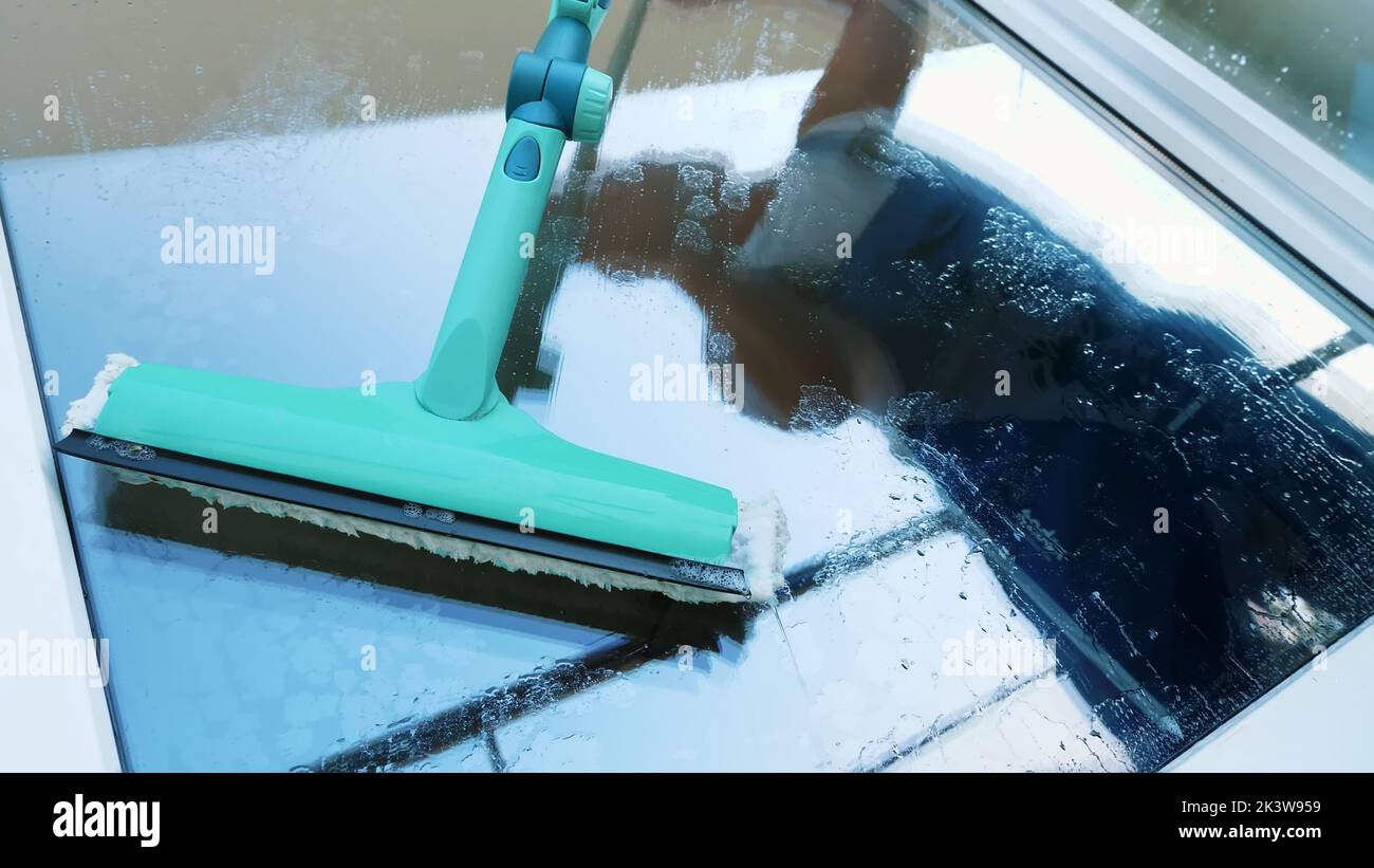 Person washing cleaning windows hi-res stock photography and images - Alamy
