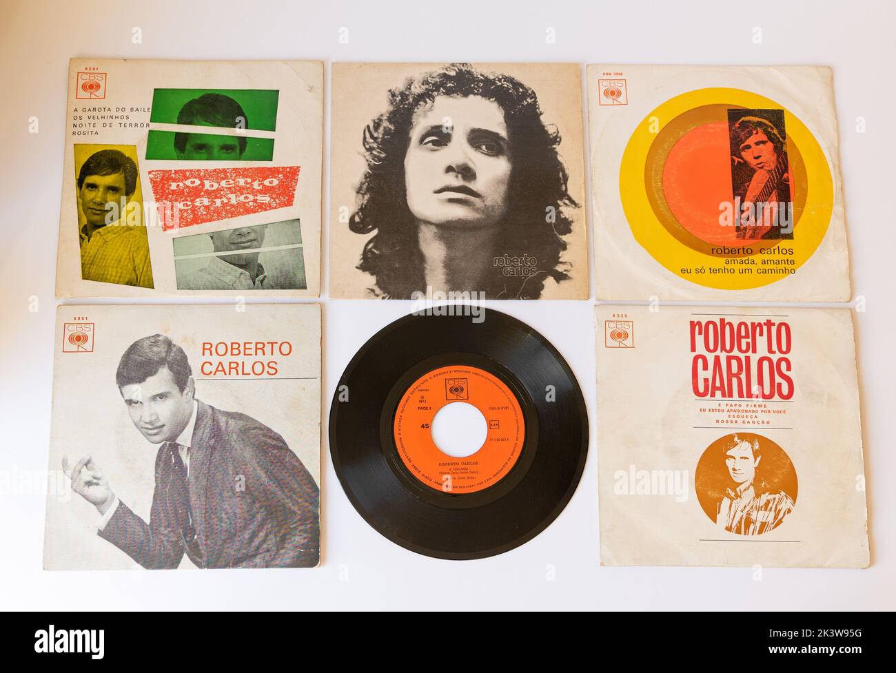 A closeup of several Roberto Carlos vinyl records on white background ...