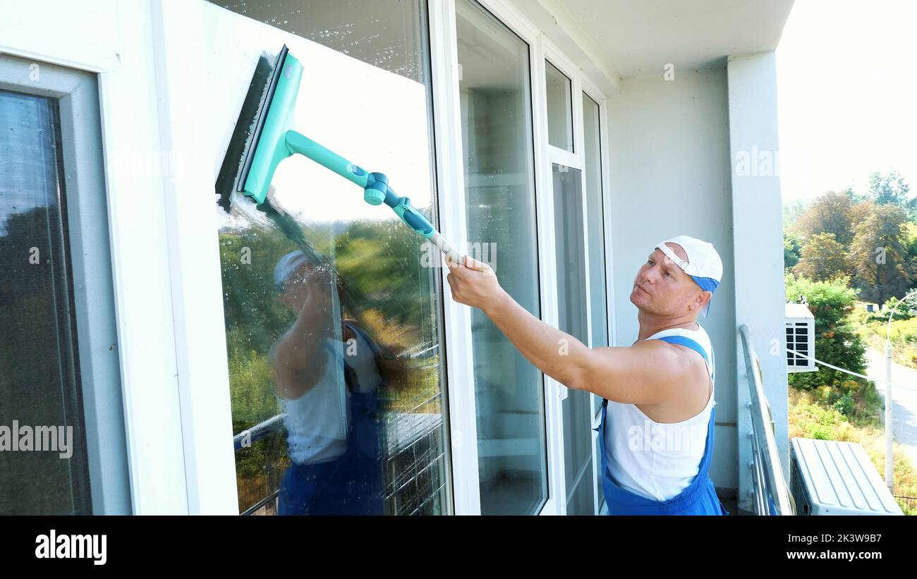 Person washing cleaning windows hi-res stock photography and images - Alamy
