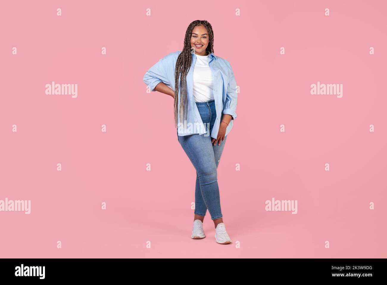 African American Plus Size Lady Model Posing Over Pink Background Stock ...