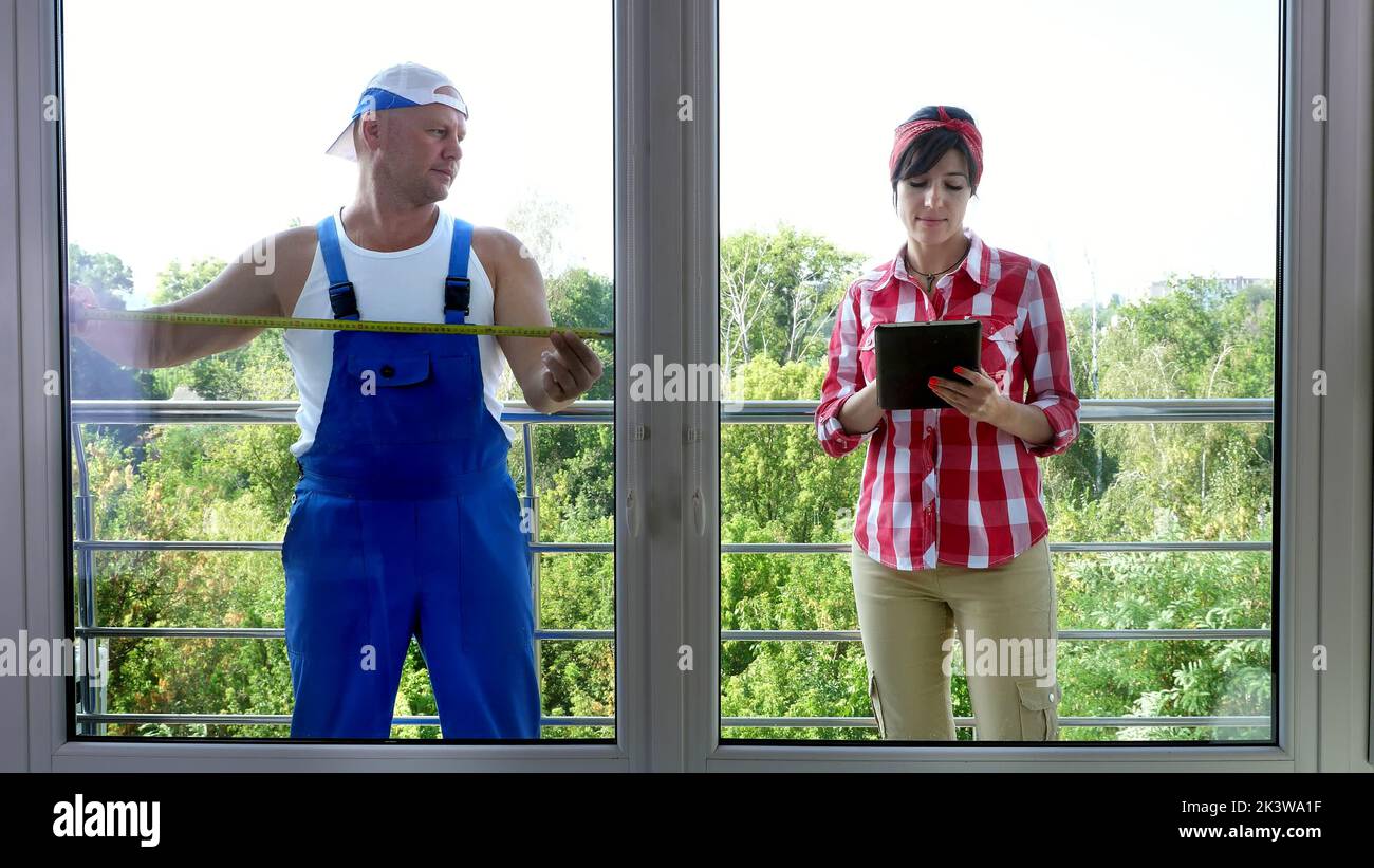 attractive Construction worker and pretty female assistant make ...