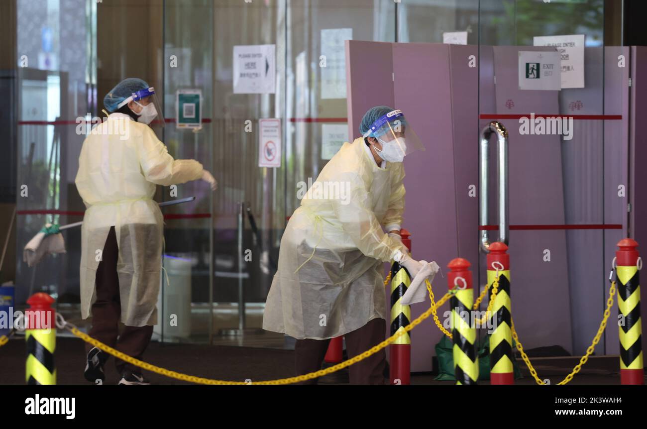 Workers clean at the Kowloon Hotel, one of the designated hotels for ...