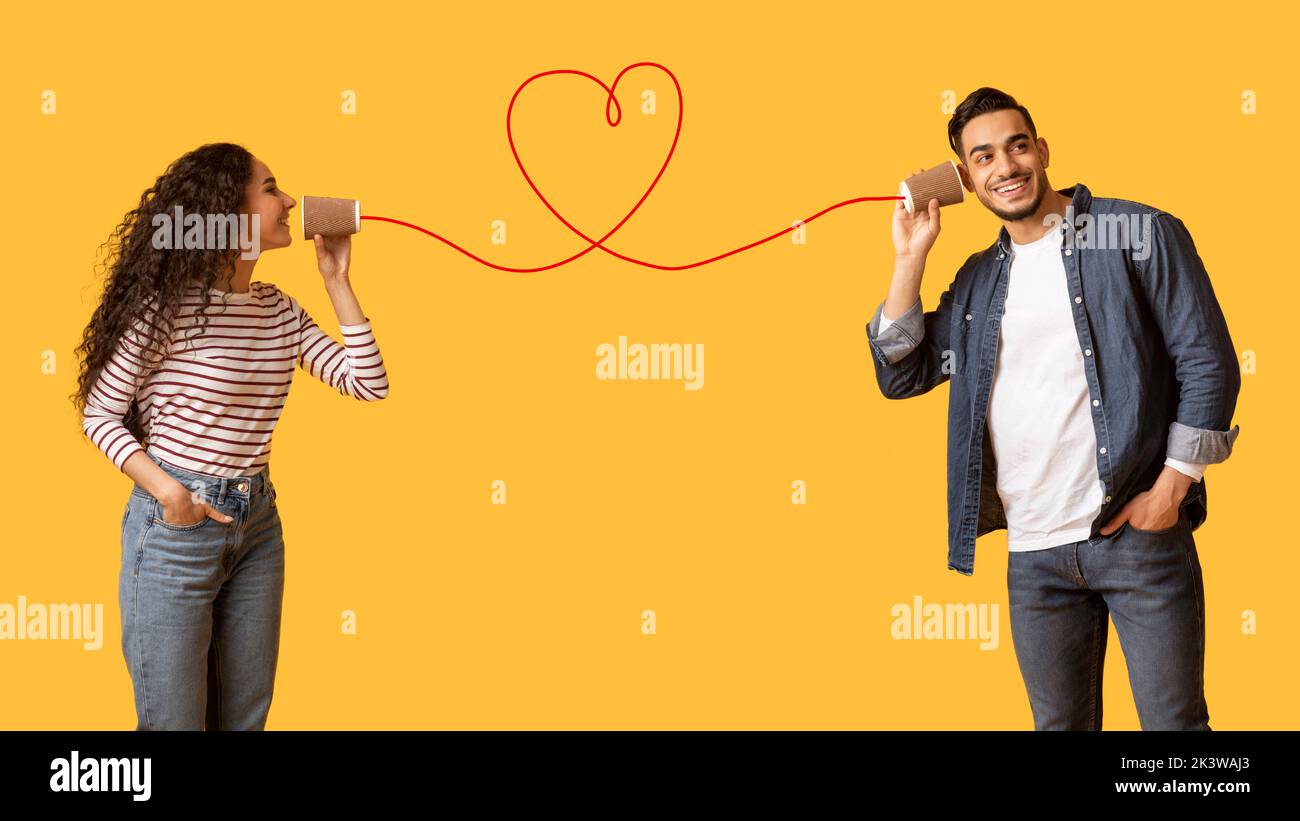 Woman Sending Love Message To Boyfriend Through Phone With Heart Shaped ...