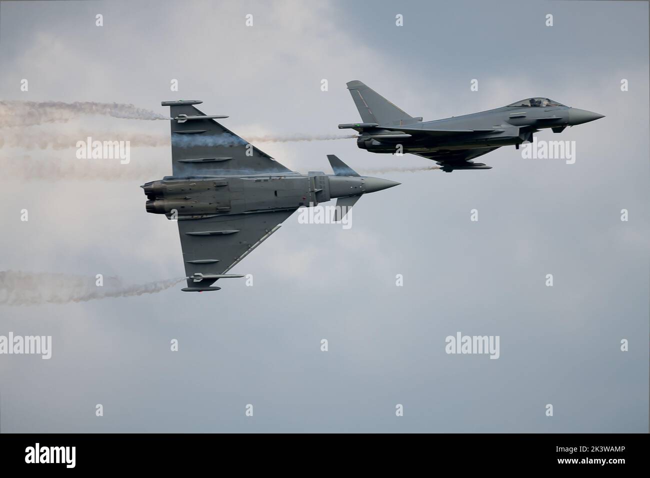 Close-up of two Typhoon Eurofighters in different flight attitudes side ...